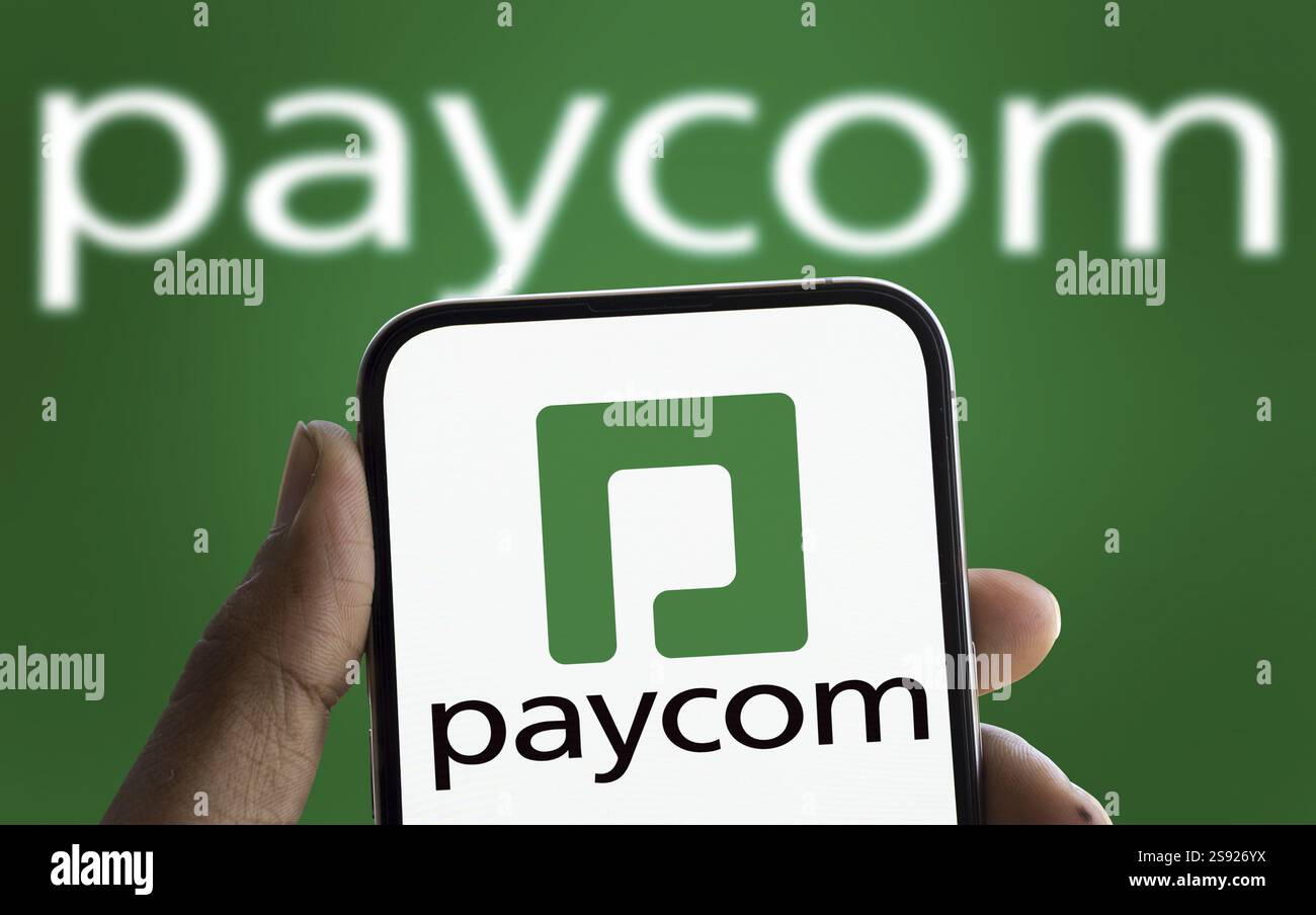 Dhaka, Bangladesh- 19 Jan 2025: paycom logo is displayed on smartphone ...