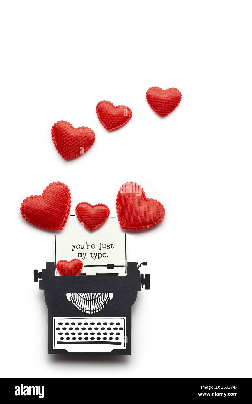 Creative valentines concept photo of a paper typewriter with hearts on ...