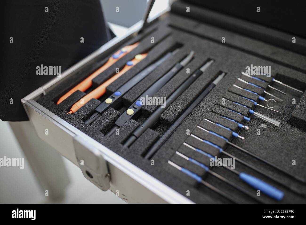 A detailed view of a toolkit with surgical instruments in a protective ...