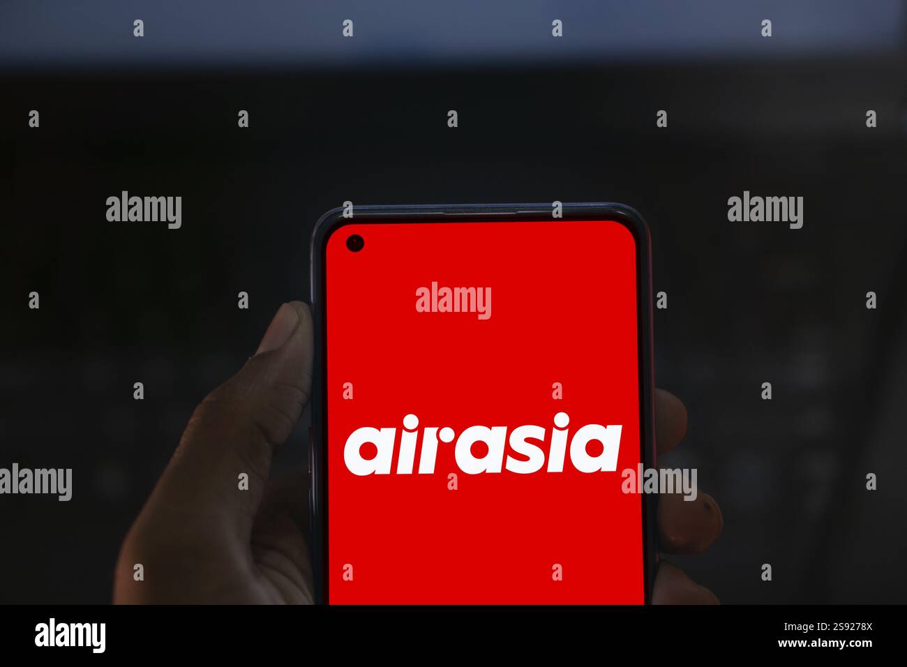 Dhaka, Bangladesh- 19 Jan 2025: airasia logo is displayed on smartphone ...