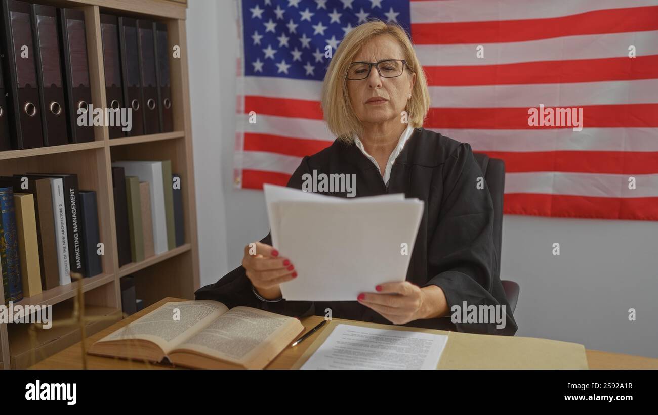 Woman judge in a courtroom reading documents with american flag, books ...