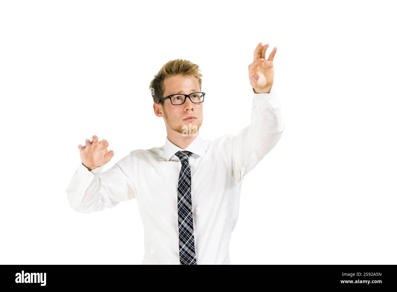 Portrait of a smart young businessman in half-length against a white ...