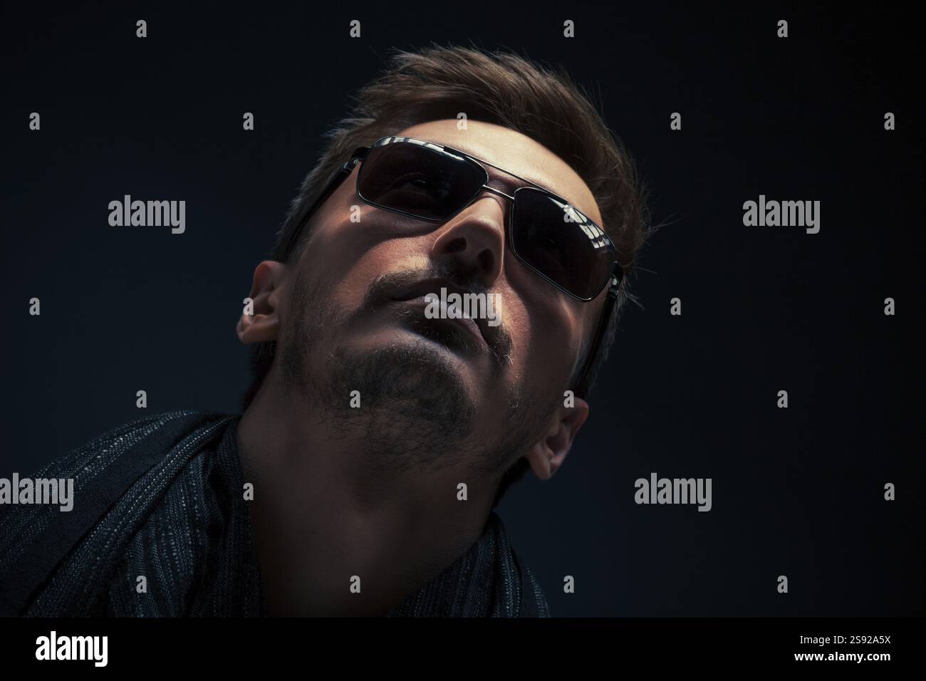 Portrait of a handsome man wearing sunglasses, unobtrusive image Stock ...