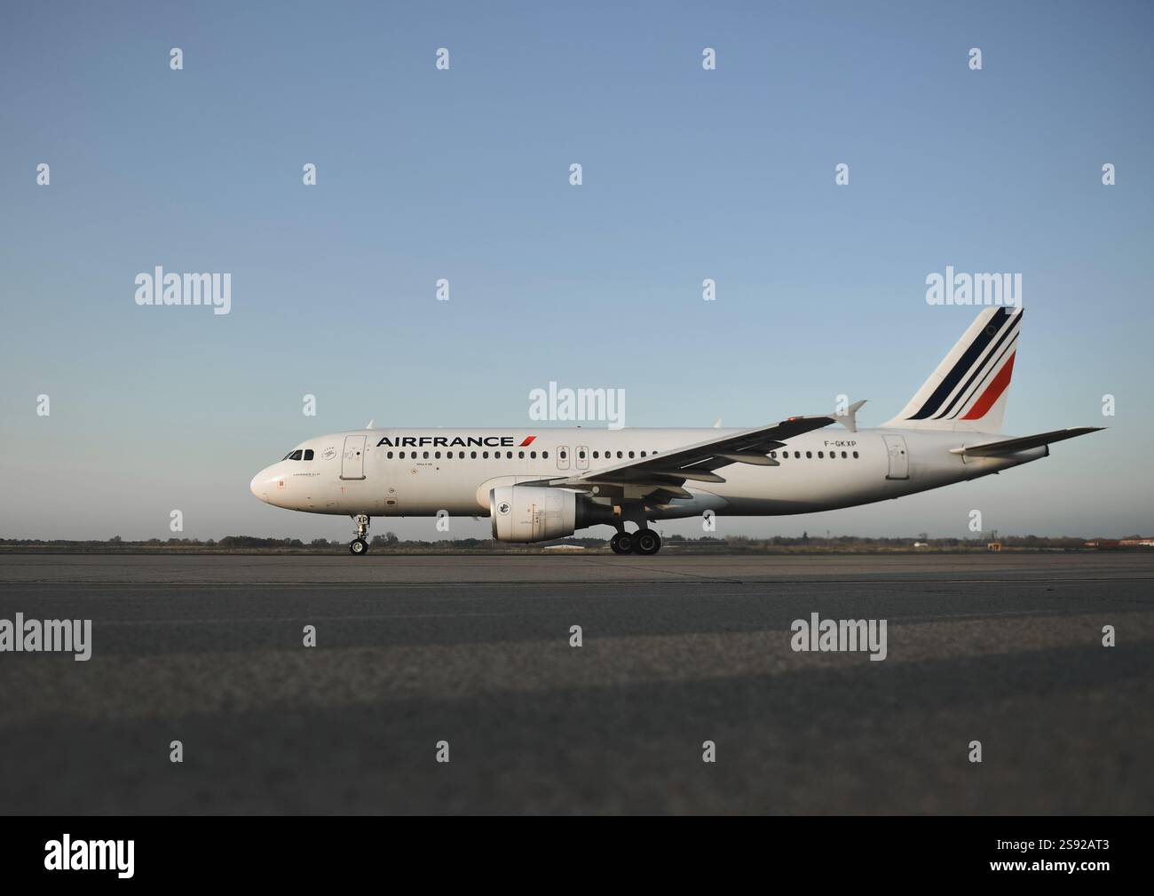 Air France passenger plane on a runway in front of a clear sky at the ...