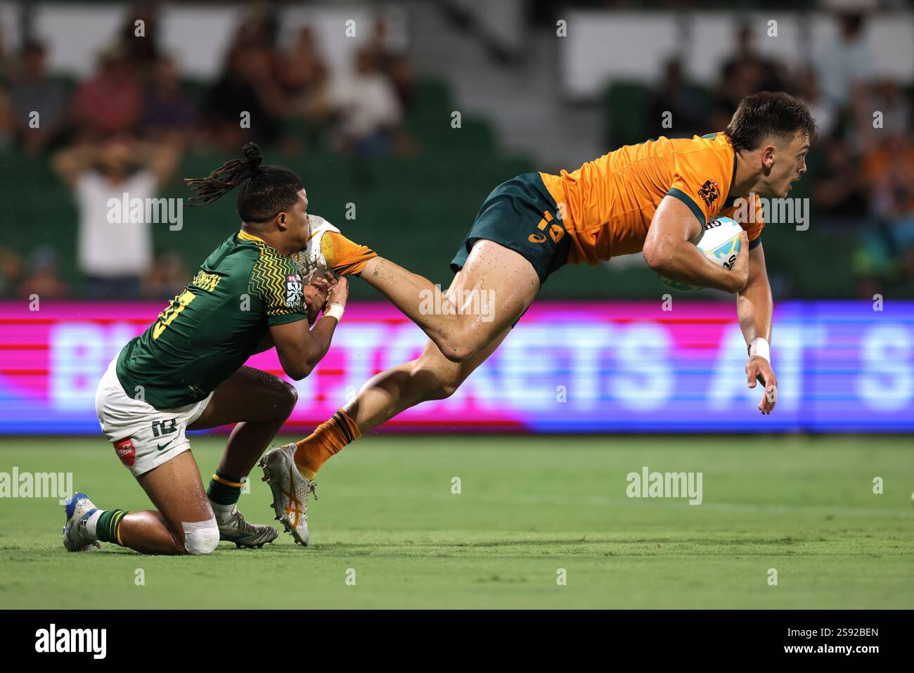 Jayden Blake of Australia is tackled by Dewald Human of South Africa ...