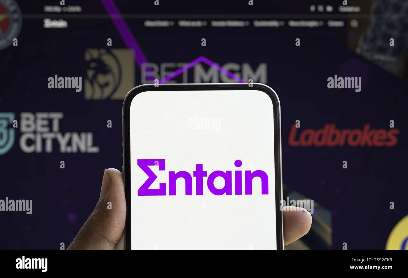 Dhaka, Bangladesh- 28 Nov 2024: Entain logo is displayed on smartphone ...