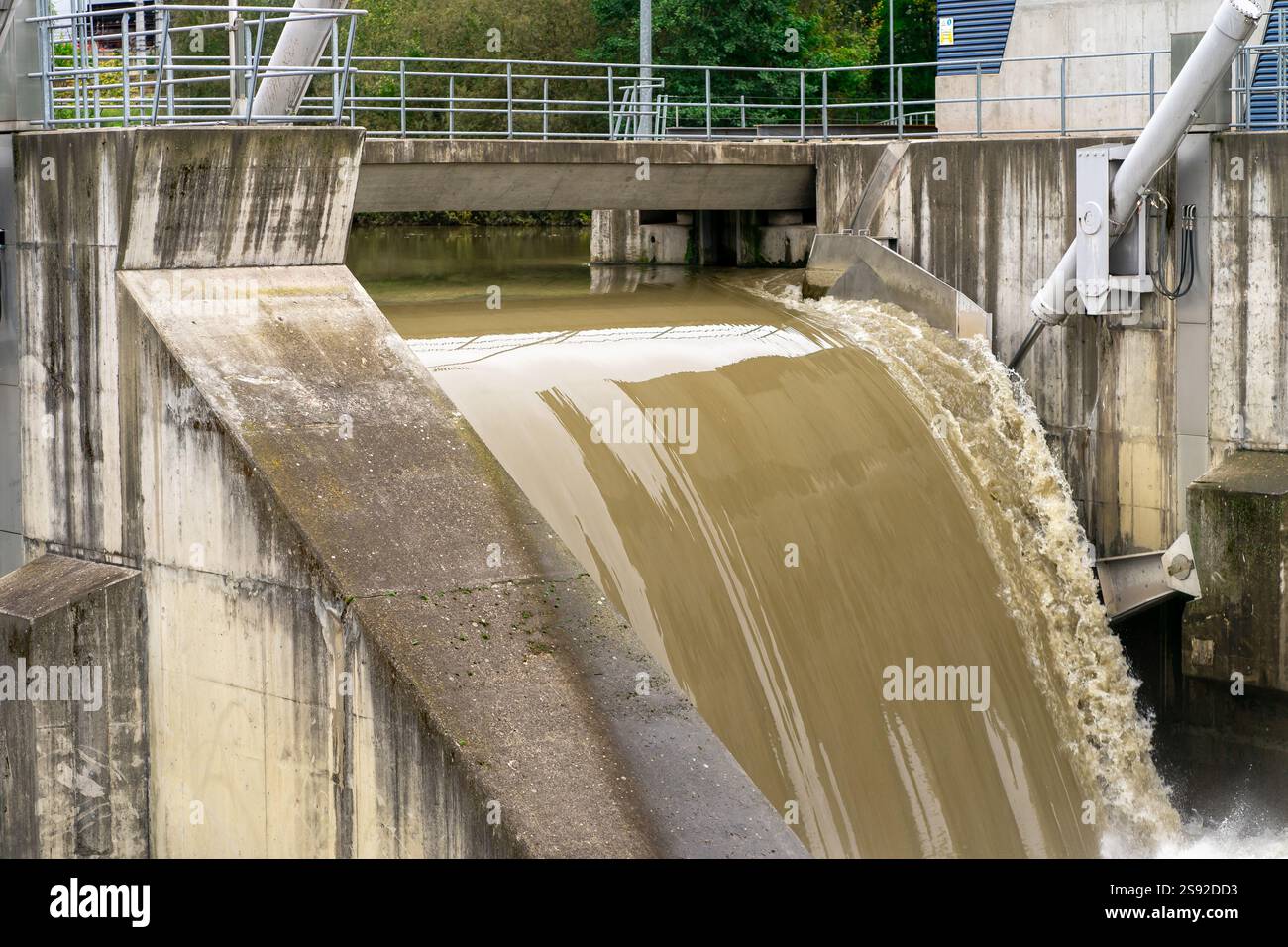 Discharge of water at the dam during floods. View of a powerful stream ...