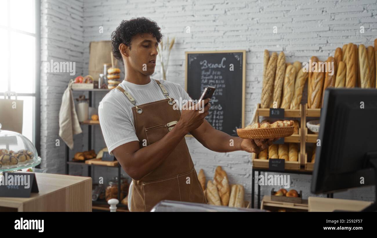 Young man taking a photo of a basket of bread in a bakery shop interior ...