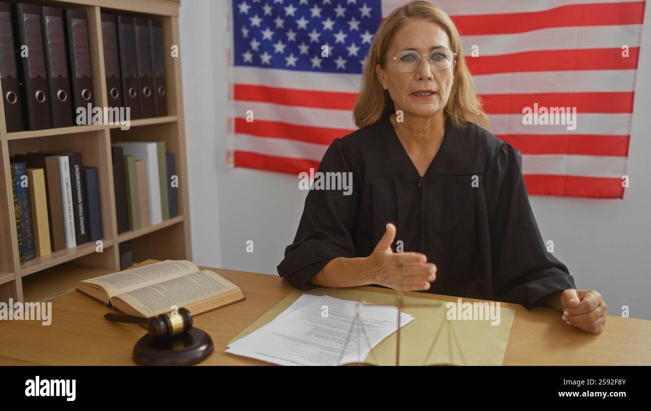 Woman judge speaking in courtroom with american flag in background ...