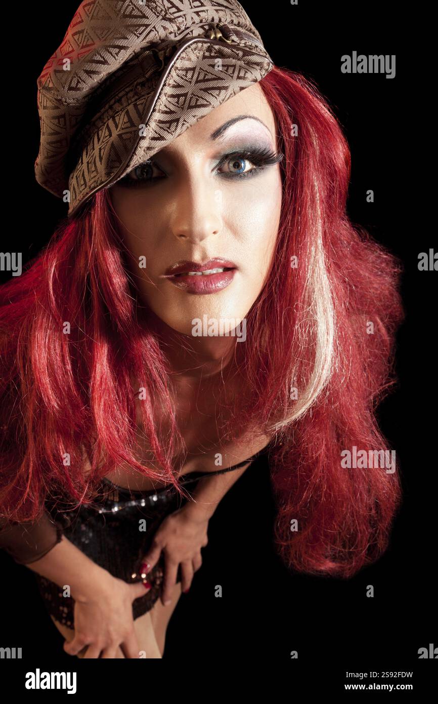 Drag Queen. Man dressed as a woman. On black Stock Photo - Alamy