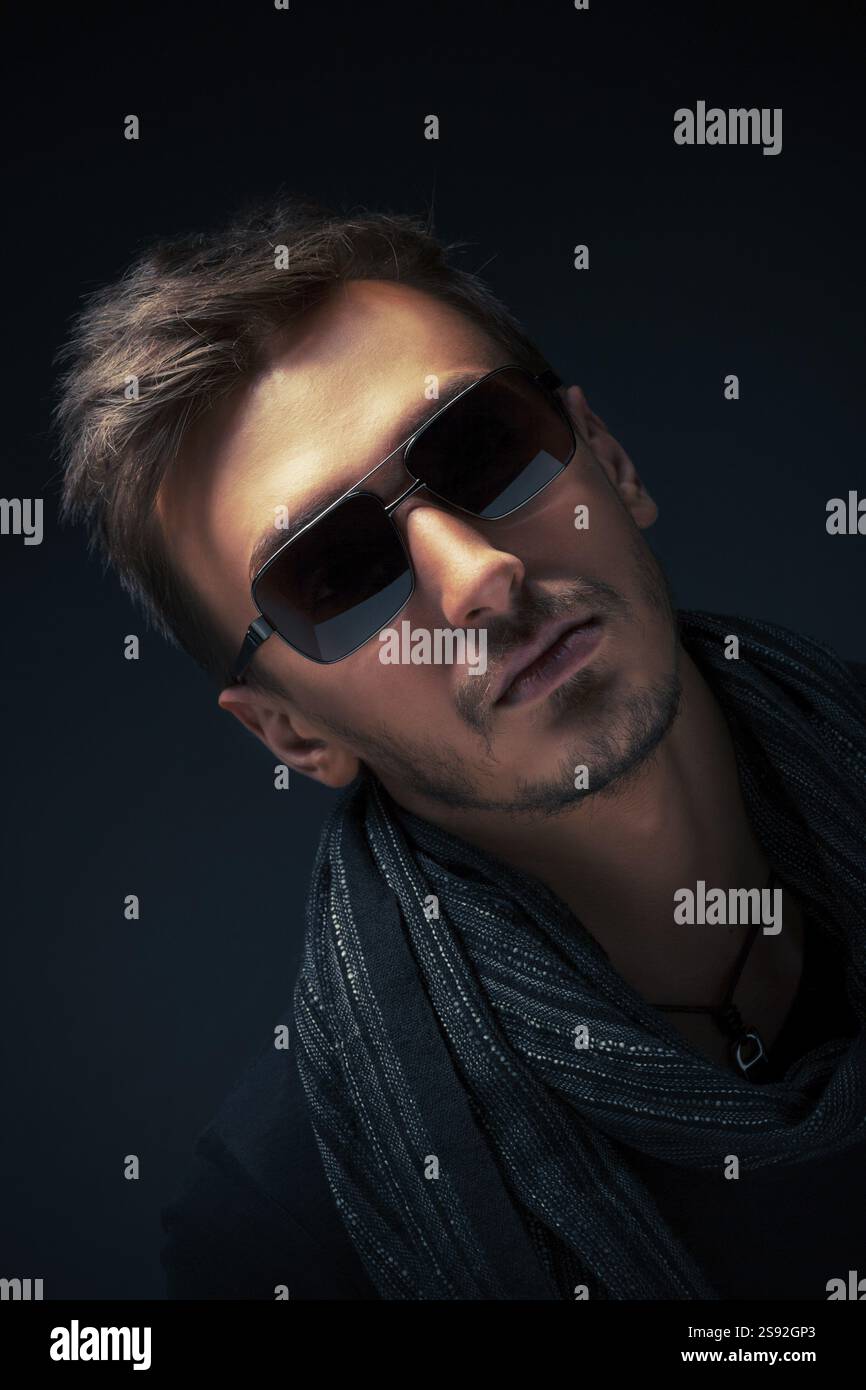 Portrait of a handsome man wearing sunglasses, unobtrusive image Stock ...