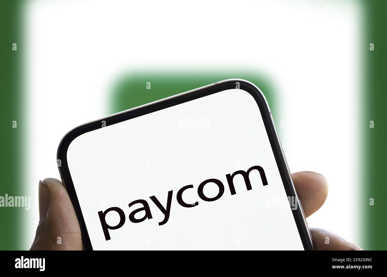 Dhaka, Bangladesh- 19 Jan 2025: paycom logo is displayed on smartphone ...