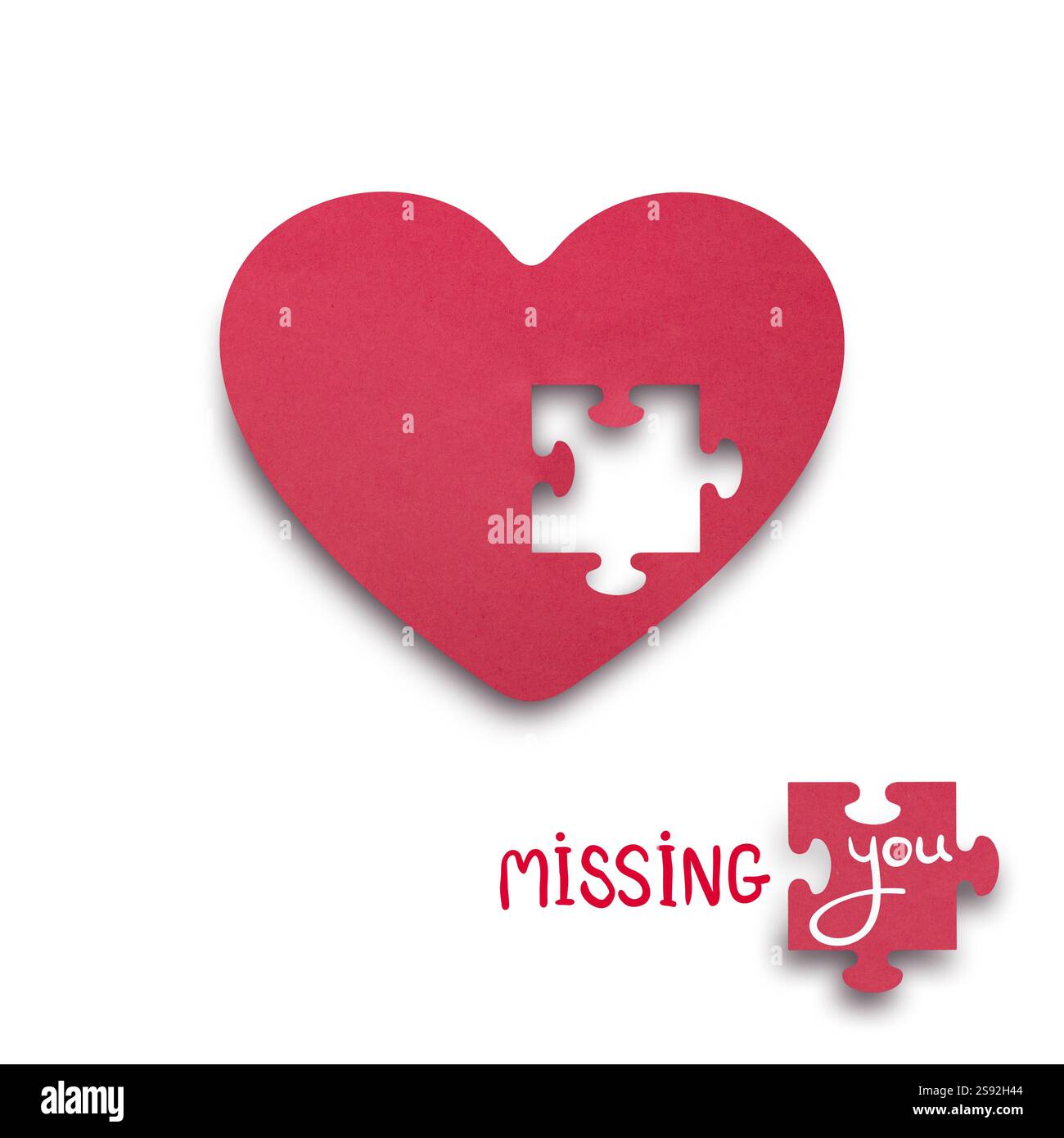 Creative valentines concept photo of a heart with a piece of puzzle on ...