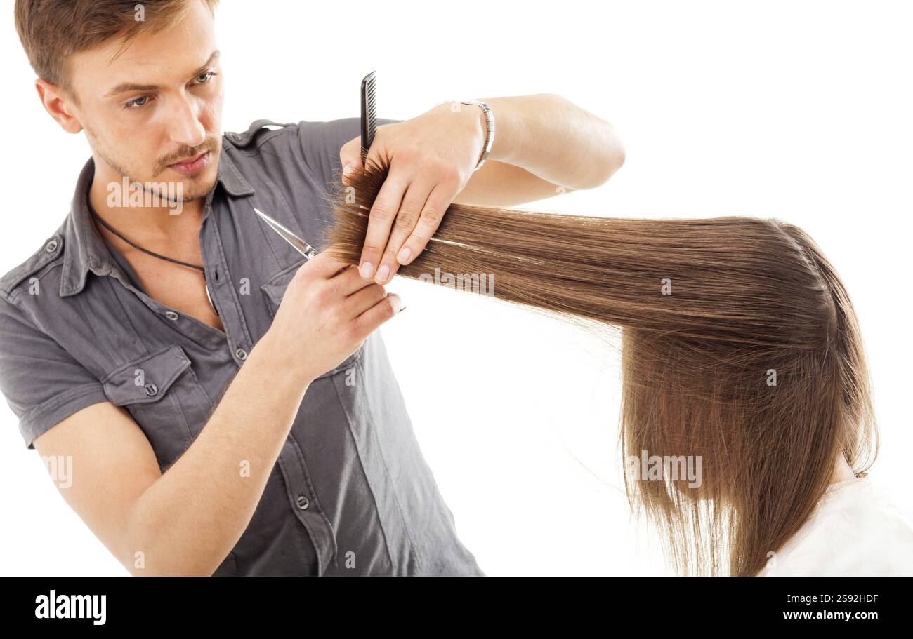 Professional hairdresser with long hair model, in front of white ...