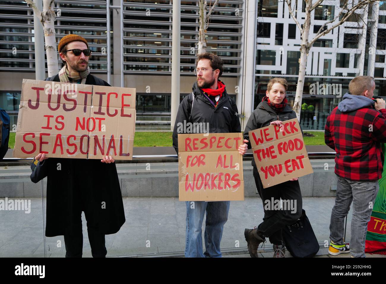 Migrant land workers protesting outside the Home Office in London call ...