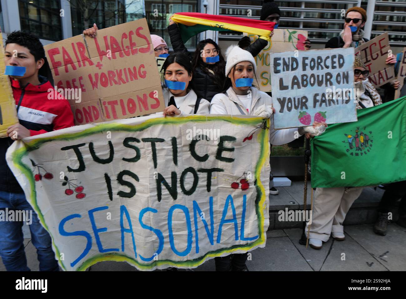 Migrant land workers protesting outside the Home Office in London call ...