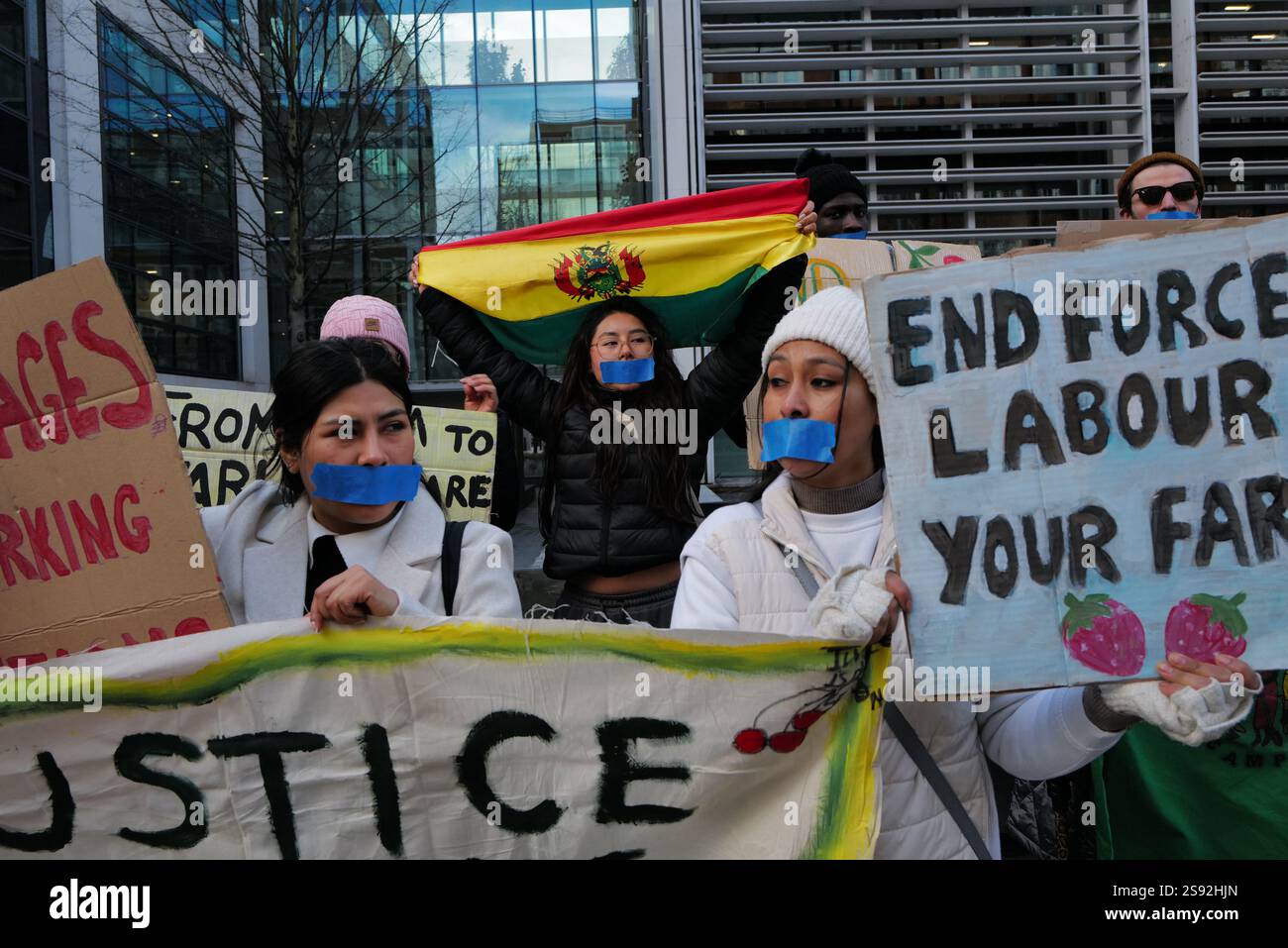 Migrant land workers protesting outside the Home Office in London call ...