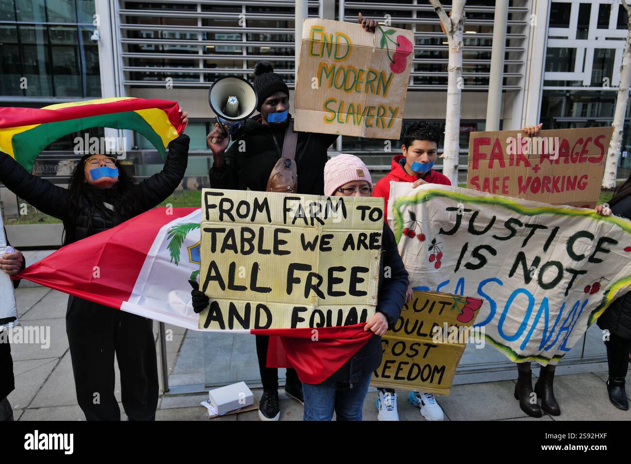 Migrant land workers protesting outside the Home Office in London call ...