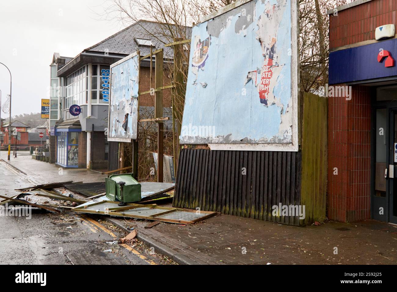 advertising hoarding damaged during high winds and fallen onto main ...