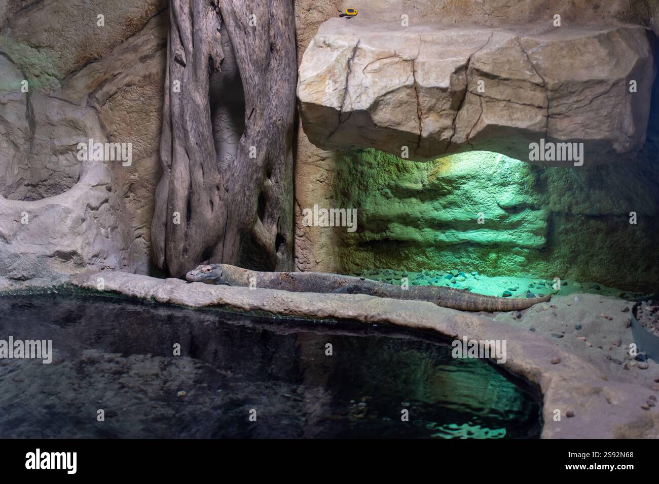 Beautiful stone cave with waterfall artificially created by man. Stone ...
