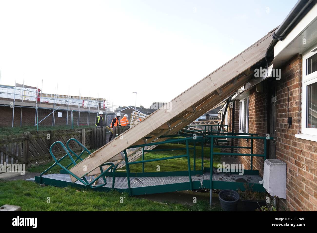 A roof blown off during strong winds rests on some bungalows in Amble ...