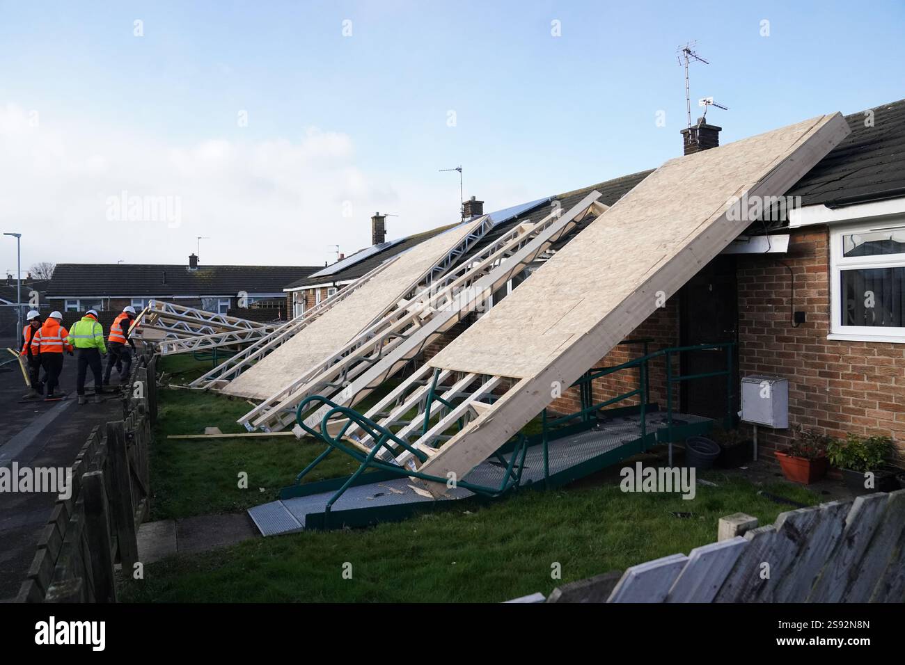 A roof blown off during strong winds rests on some bungalows in Amble ...