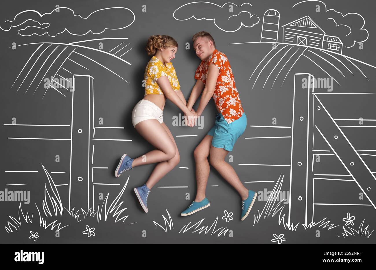 Happy valentines love story concept of a shy romantic couple sitting on ...