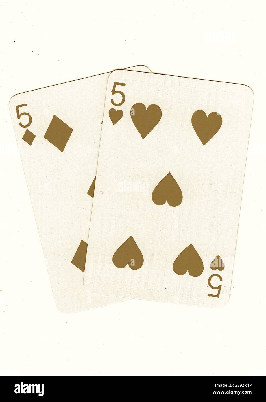 A pair of vintage playing cards showing the same value in sepia ...