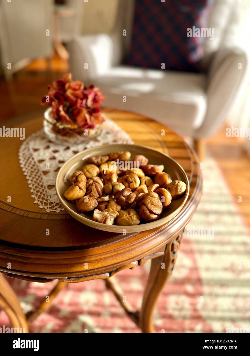 Roasted grilled chestnuts in plate ready to eat at home Stock Photo - Alamy