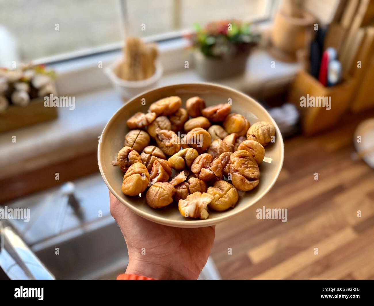 Roasted grilled chestnuts in plate ready to eat at home Stock Photo - Alamy