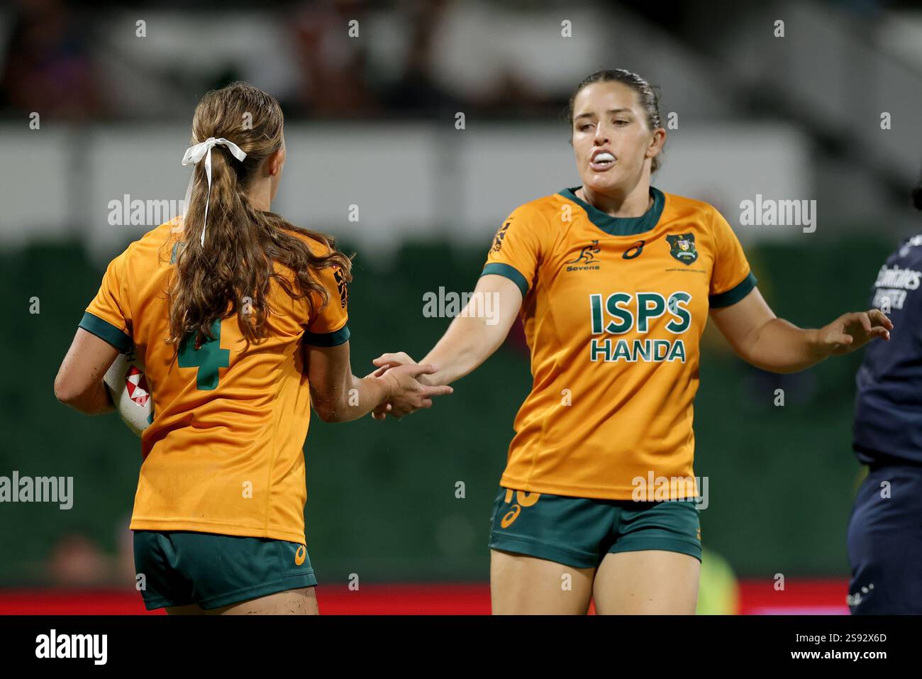 Mackenzie Davis (left) of Australia is congratulated by Sidney Harvey ...