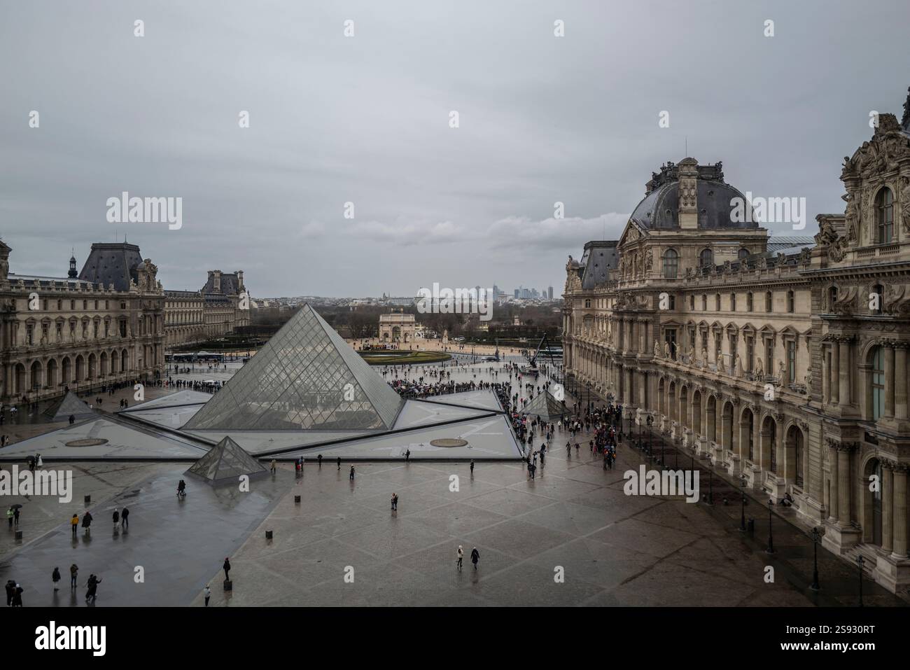 View of the Louvre Pyramid and tourists present outside the pyramid ...