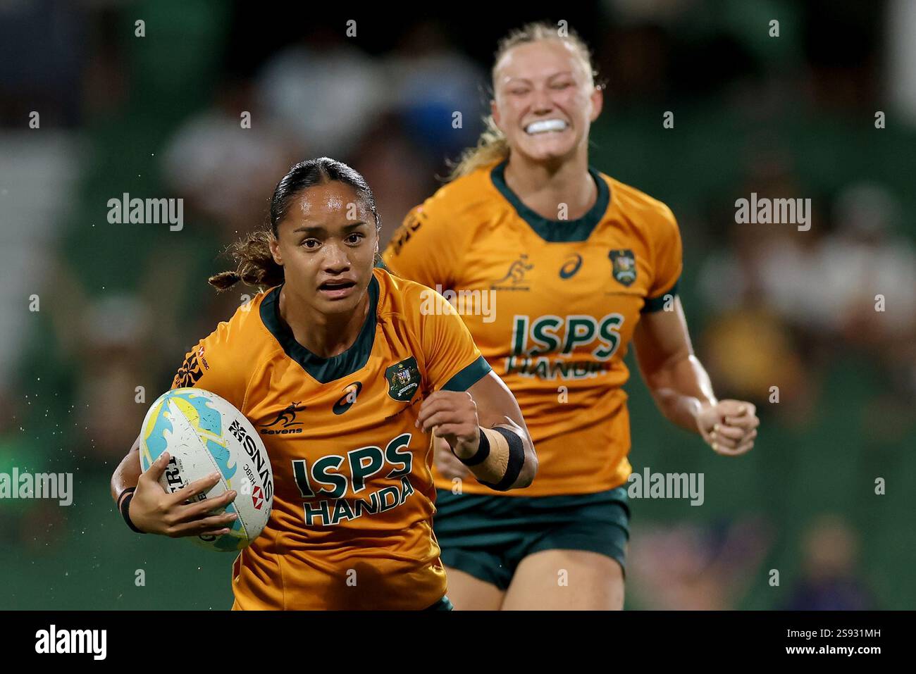 Faith Nathan of Australia runs in for a try against Spain during the ...