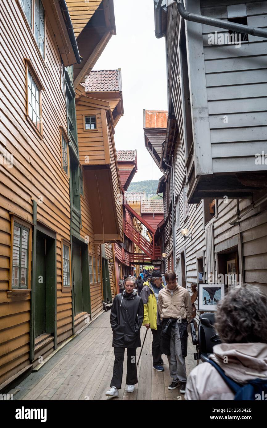 Tourists in the Bryggen Hanseatic Wharf former commercial area of ...