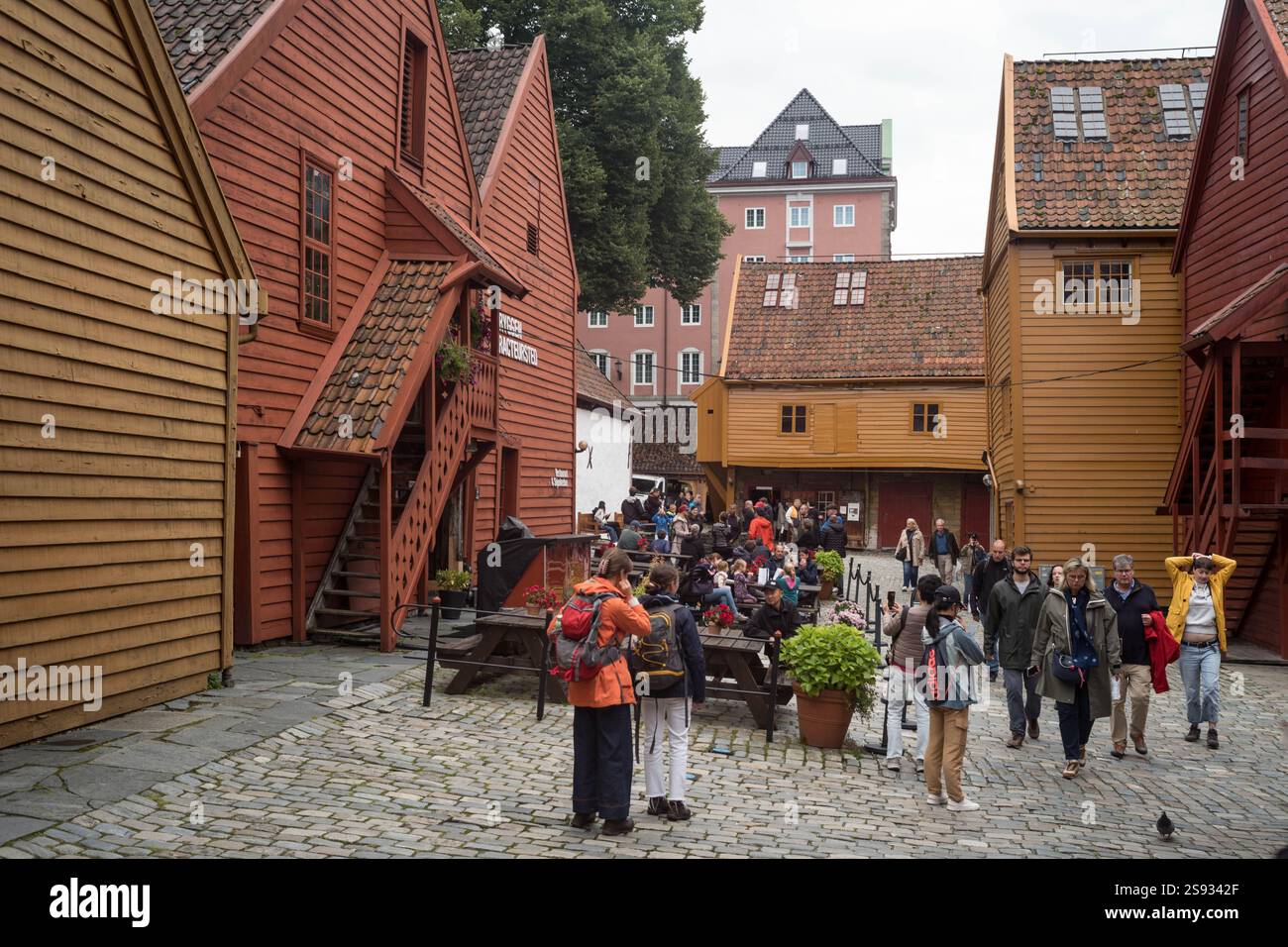 Tourists in the Bryggen Hanseatic Wharf former commercial area of ...