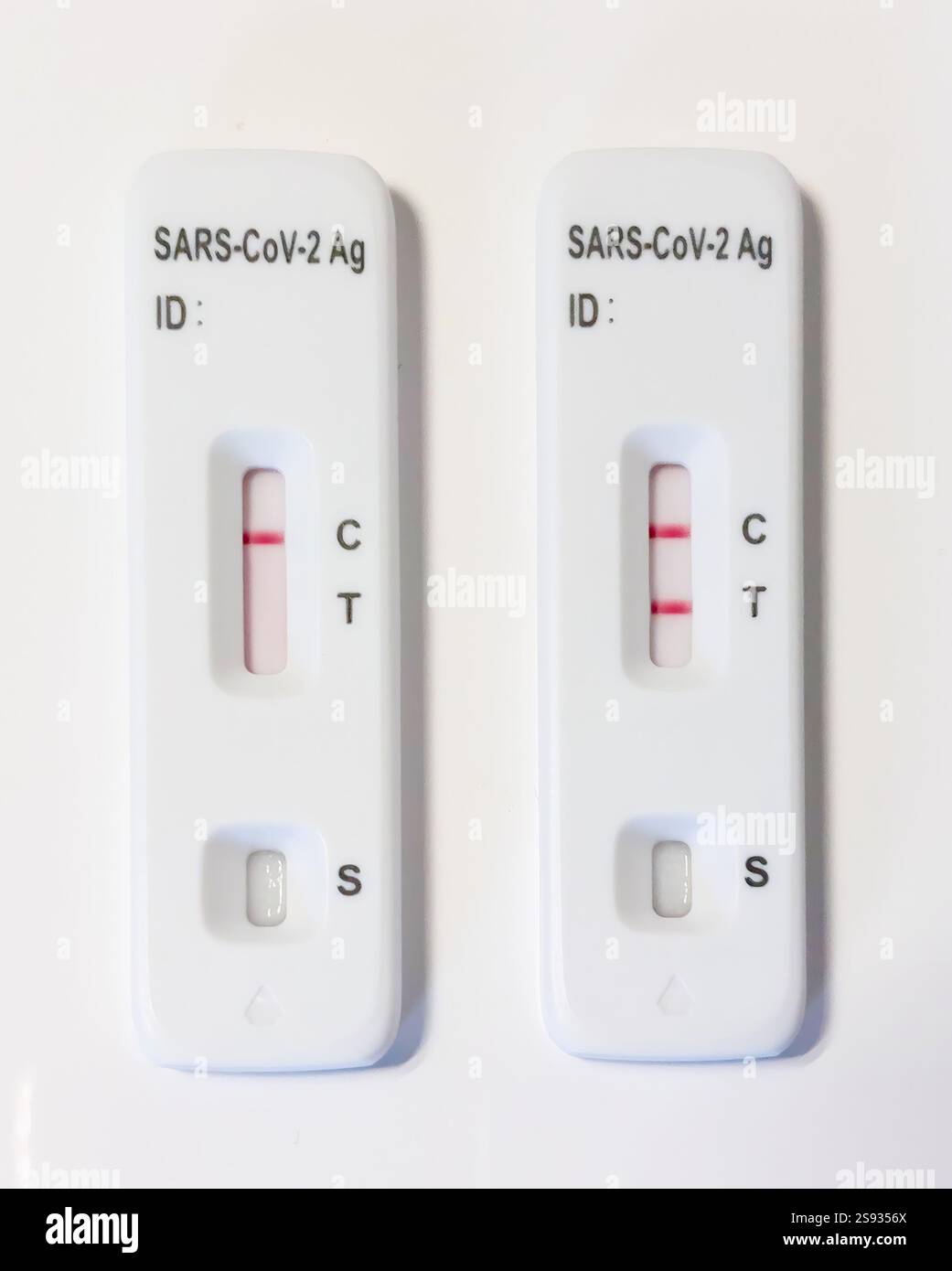 Displaying two SARS CoV 2 antigen self testing kits showing positive ...