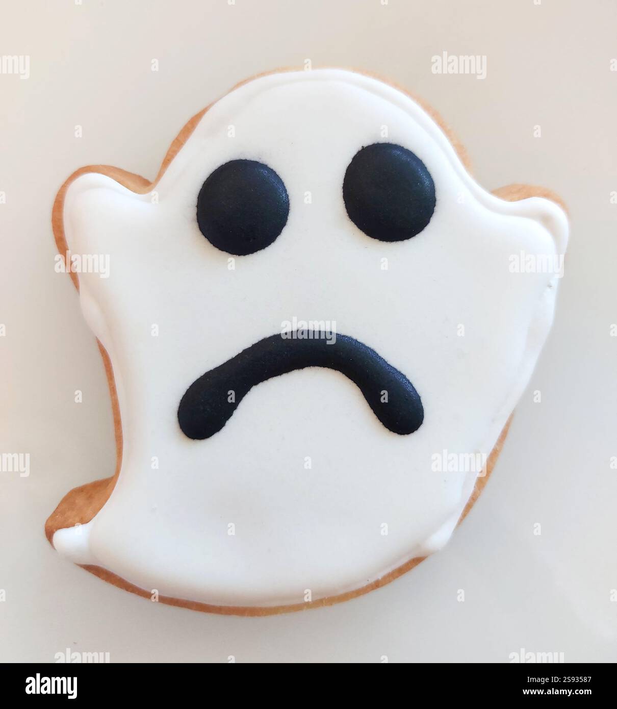 Homemade ghost shaped cookie decorated with royal icing for Halloween ...