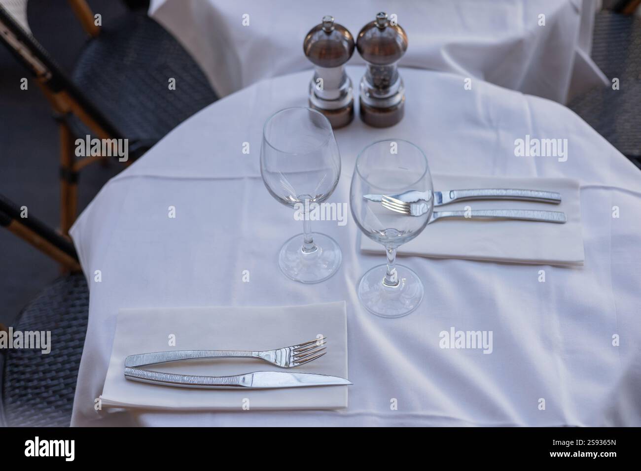 Elegant table setting for fine dining with wine glasses and cutlery in ...