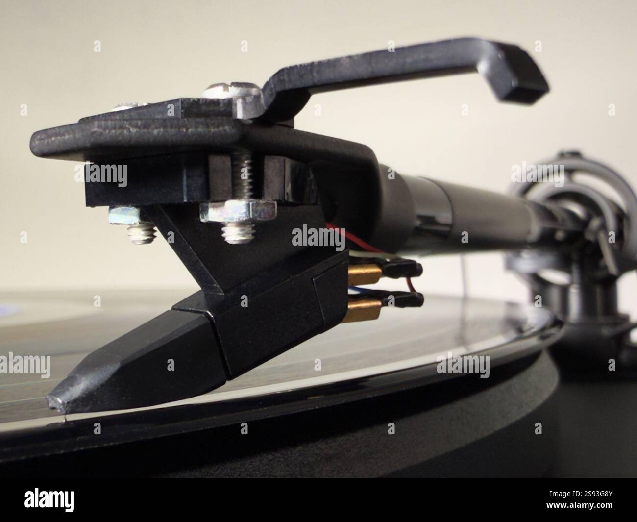 Macro closeup of the needle stylus of a record player turntable, on a ...