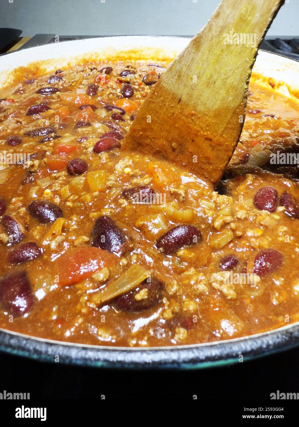 Closeup of a pan of steaming hot chilli con carne (spicy minced beef ...