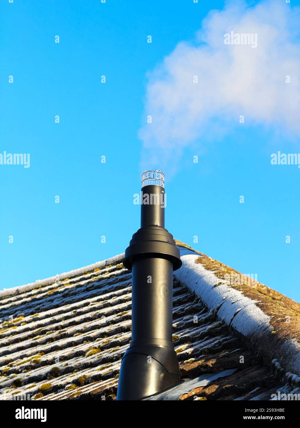 A new flue pipe from a burning heating boiler, expelling fumes through ...