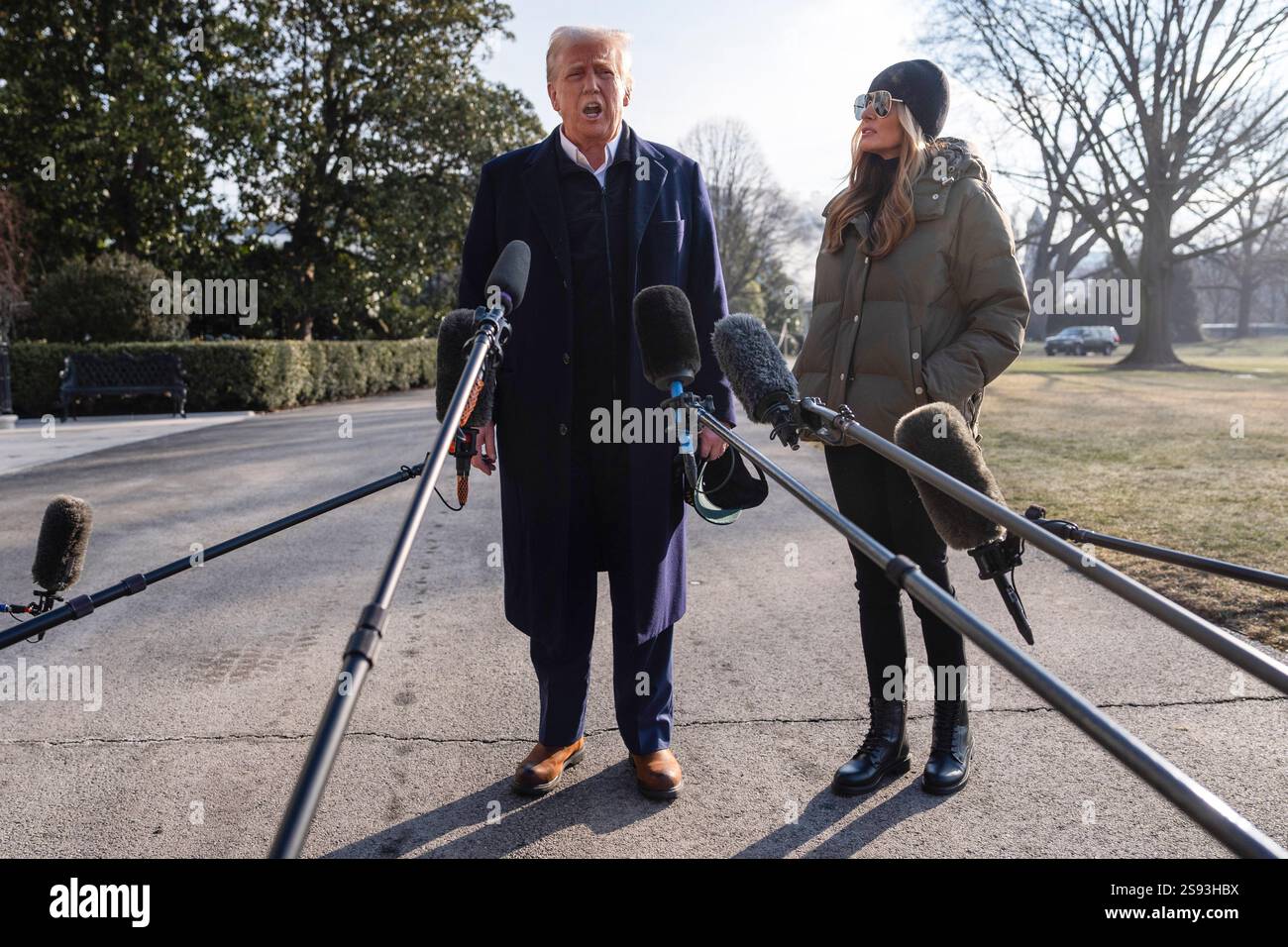 First lady Melania Trump looks on as President Donald Trump speaks with ...