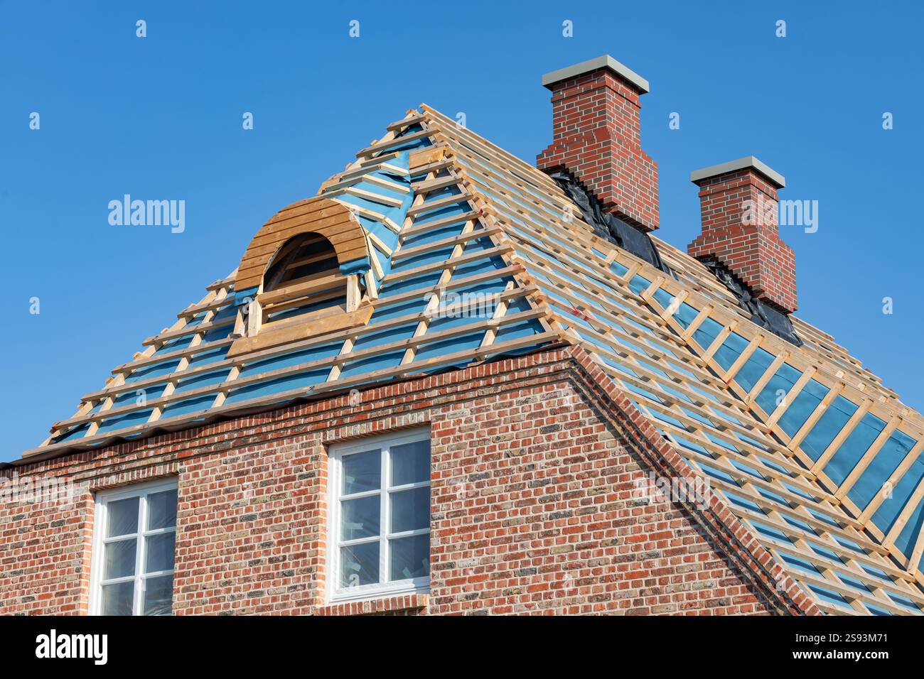 New building with clinker brick wall and roof battens for thatched ...