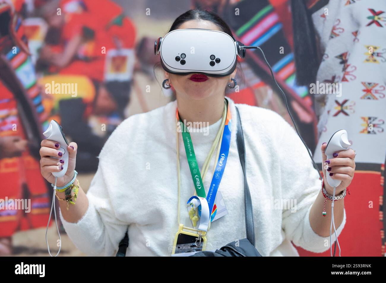 A woman with virtual reality glasses during the FITUR International ...