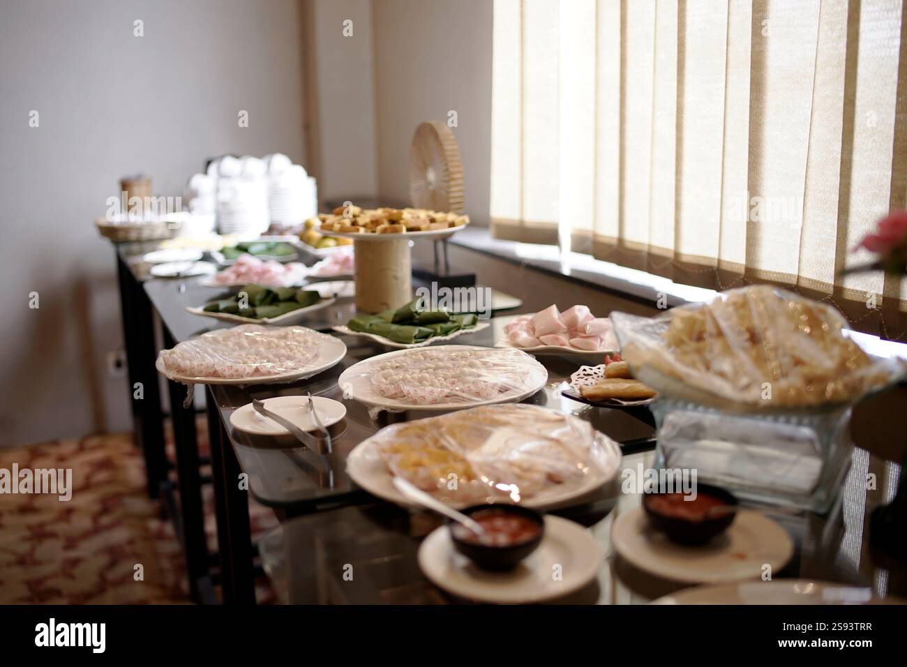 authentic Indonesian snacks served at the table for a coffee break ...