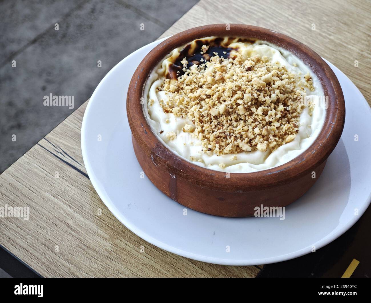 Traditional Turkish dessert sutlac rice pudding with roasted pistachio ...