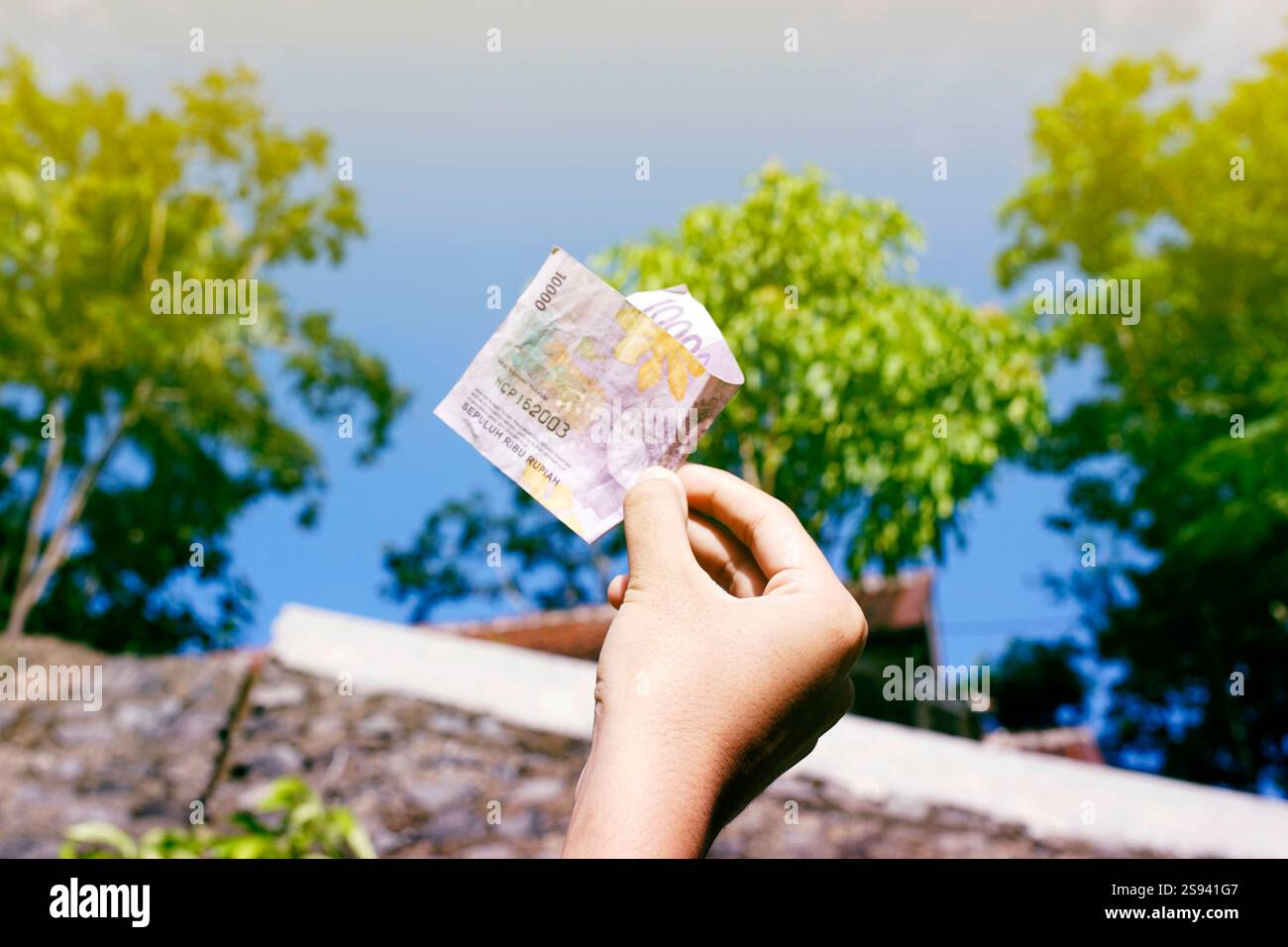 the concept of donation by giving Stock Photo - Alamy