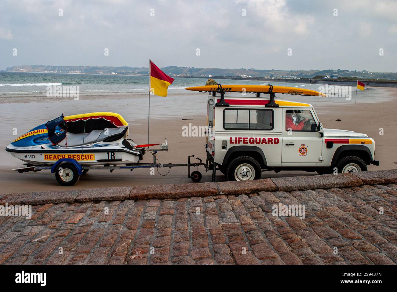 Lifeguard beach rescue patrol Land Rover with jet ski on trailer at Le ...