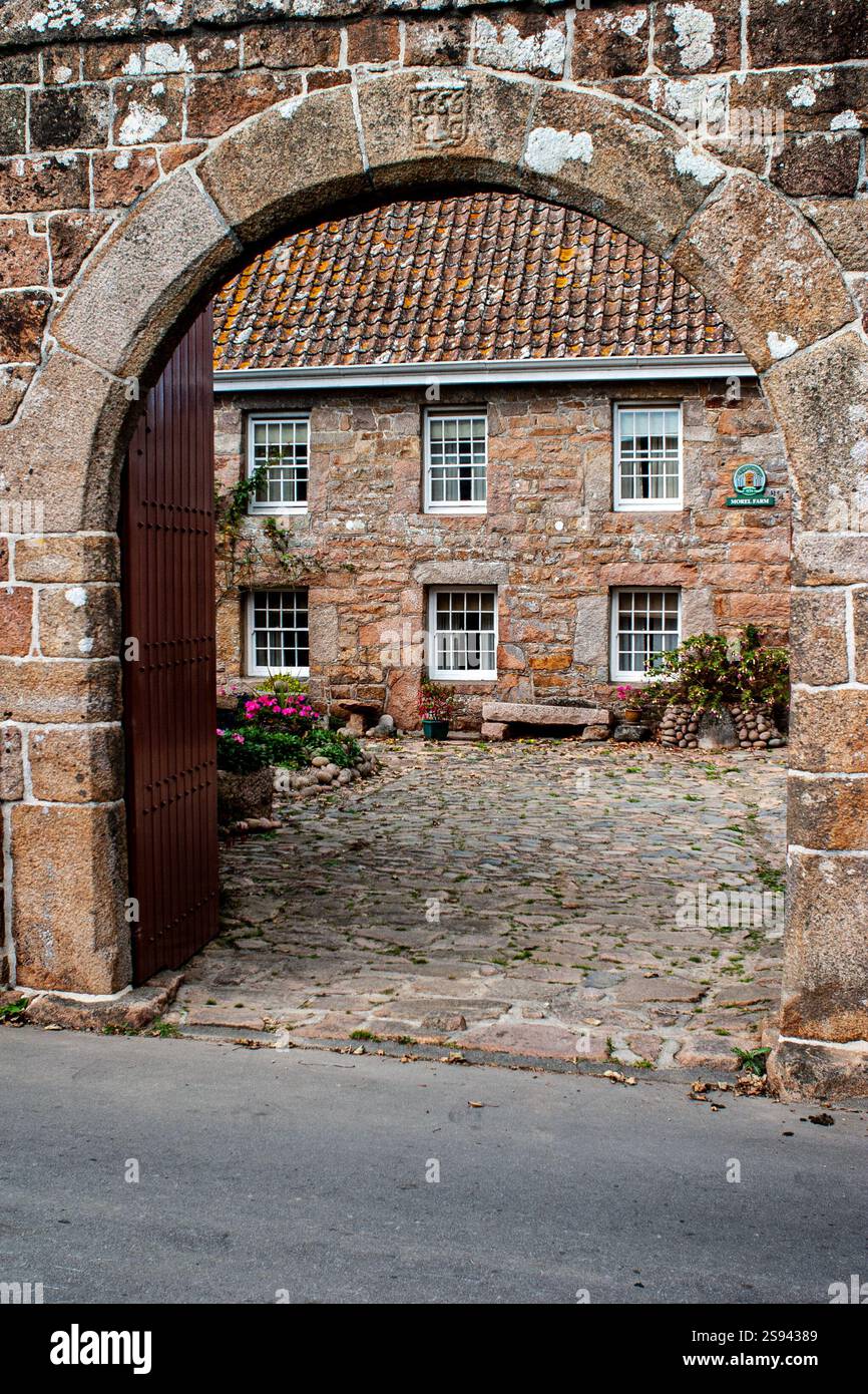 Archway entrance to cobbled courtyard at Jersey National Trust owned ...