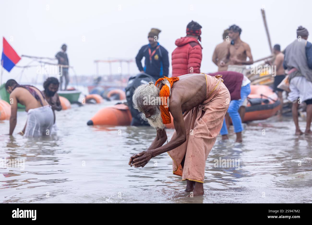 Mahakumbh, Group of holy sadhu and devotees marching towards the river ...